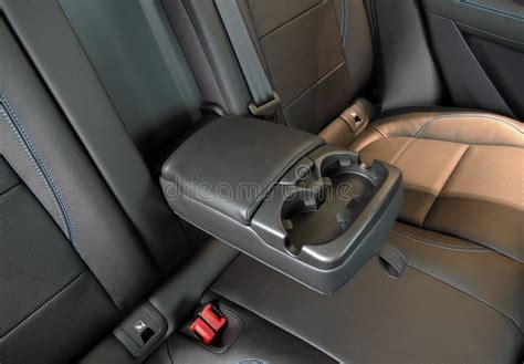 Rear Fold Down Center Armrest In Luxury Vehicle Interior With Stitched