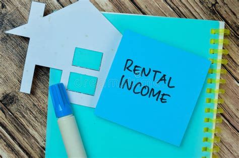 Concept Rental Income Write Sticky Notes Isolated Wooden Table Stock