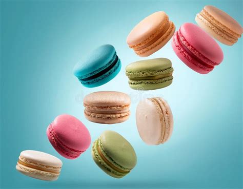 Flying Macarons Different Types Of Macaroons In Motion Falling On Light Blue Background Stock