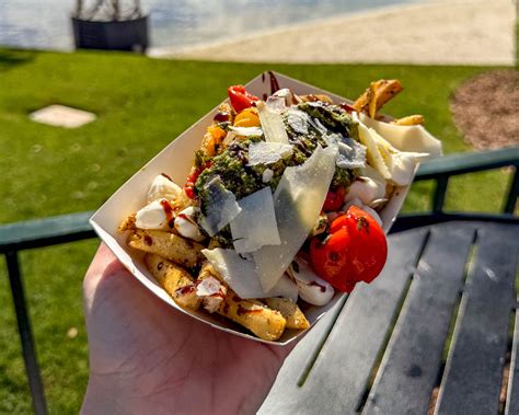 Where To Get The Most Colorful Poutine At The 2025 Epcot Festival Of The Arts
