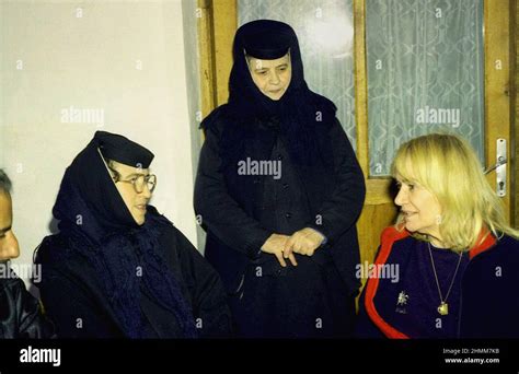 Romanian Journalist And Writer Sanziana Pop During An Assignment At A Local Monastery Approx