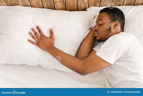 African Man Sleeping After Breakup Alone Lying In Bed Indoor Stock
