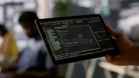 Data Scientist Uses Tablet To Check On Machine Learning Models Close Up Stock Image Image Of