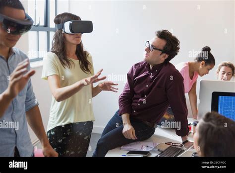 Computer Programmers Testing Virtual Reality Simulator Glasses In