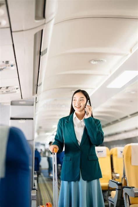 Young Asian Executive Excels In First Class Multitasking With Digital