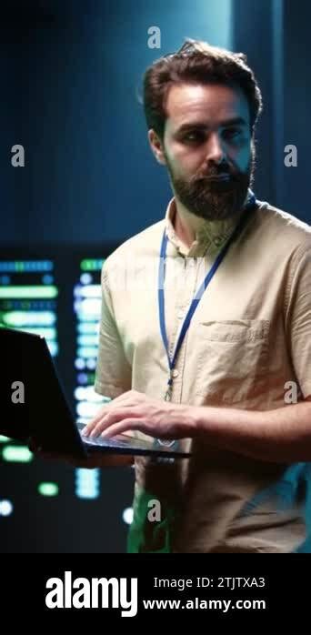 Vertical Video Programmer Doing Annual System Examination Checking Data On Laptop Of Needed