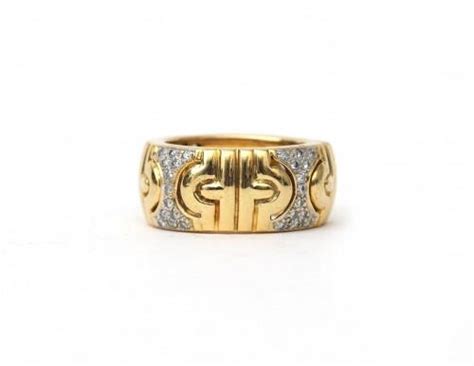 Lot Art An 18 Karat Gold Diamond Band Featuring Incrusted Brilliant