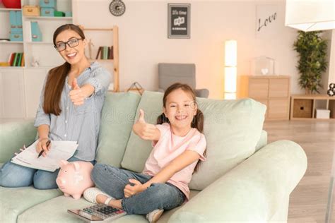 Mother And Daughter Counting Money Indoors Money Savings Concept Stock
