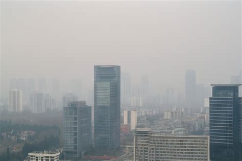 Premium AI Image Highrise Office Building With Smog And Air Quality