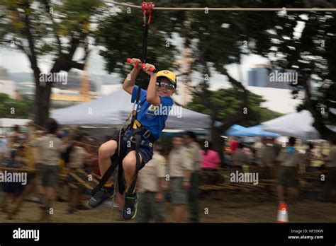 Jordan Perry A Cub Scout Slides Down A 40 Foot Long Zip Line During