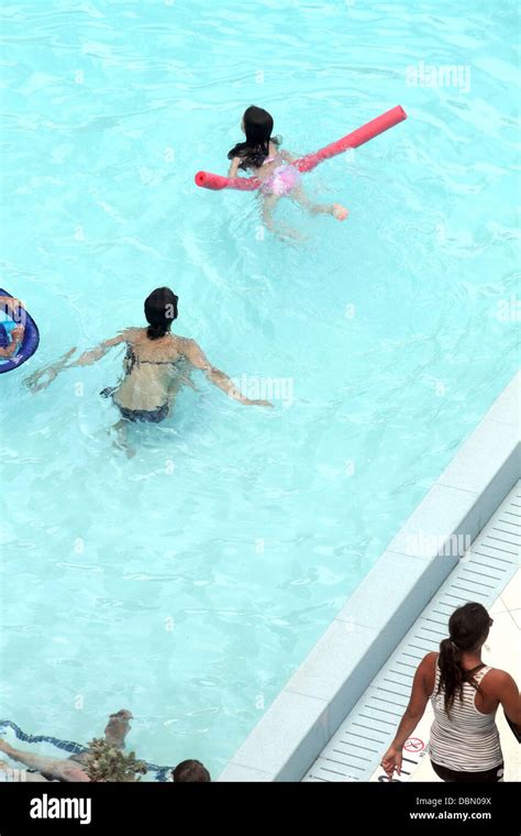 Suri Cruise And Her Mother Katie Holmes Swimming And Playing Games In