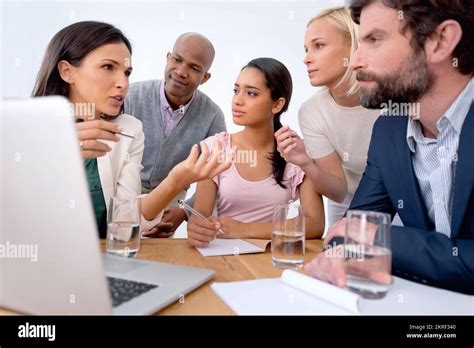 Brainstorming About Their Latest Project A Group Of Business People In