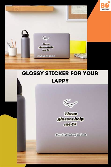 Two Laptops Sitting On Top Of A Wooden Desk