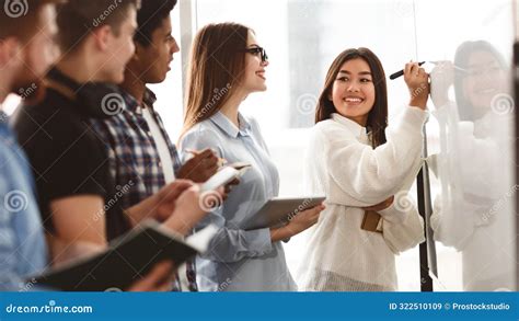 Girl Showing Answers On Whiteboard In Classroom Stock Image Image Of Real Discussion 322510109
