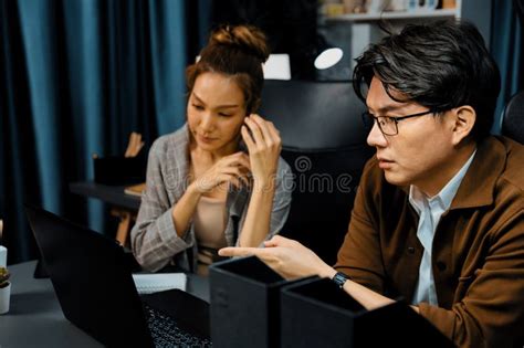 Working Sales Manager Pointing To Missing Report Data With Coworker Infobahn Stock Image