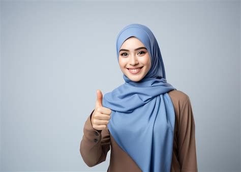 Premium Ai Image Hijabi Women Thumb Up Realistic Photo Ai Generated