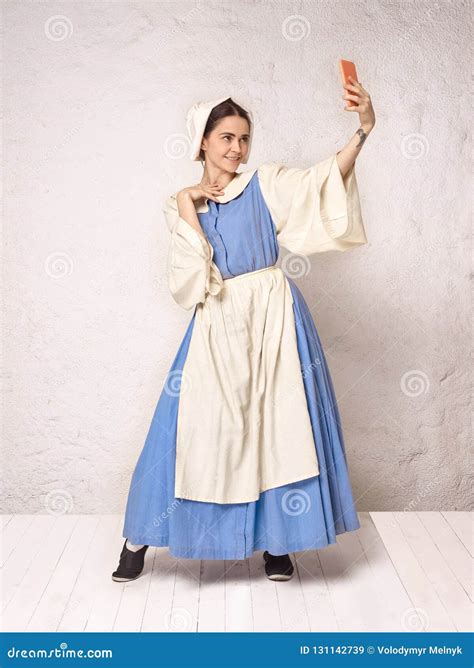 Medieval Woman In Historical Costume Wearing Corset Dress And Bonnet Stock Image Image Of