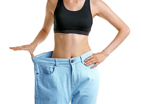 Premium Photo Girl In Huge Pants On White Background