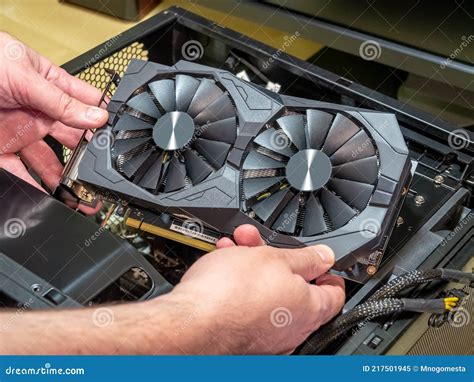 Pc Assembly And Upgrade Installing Video Card In An Open Case Of Personal Computer Stock Image