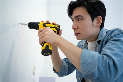 Premium Photo Asian Man Measuring And Repairing Housesxa