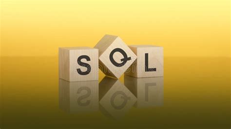 Three Wooden Cubes With The Letters Sql On The Bright Yellow Surface The Inscription On The