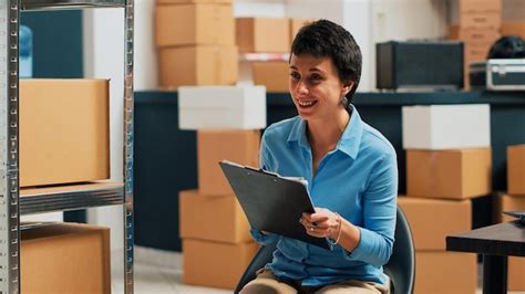 Premium Photo Person Checking Storehouse Merchandise On Shelves Doing Inventory With