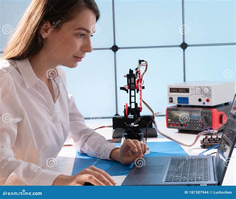 A Young Woman Writes An Algorithm For The Robot Arm Science Research