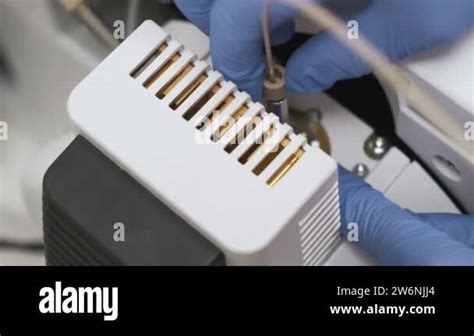 Laboratory Technician Unscrews The Capillary Into The Nebulizer Needle