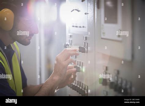 Male Worker Operating Machinery At Control Panel In Factory Stock Photo Alamy