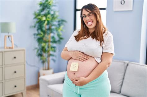Pregnant Woman Expecting A Baby Wondering Sex Sticking Tongue Out Happy