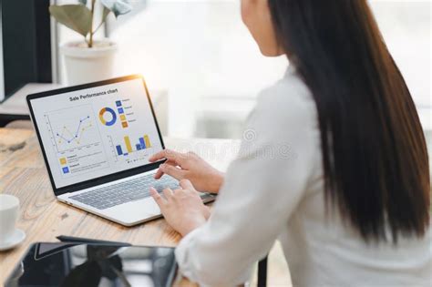 Professional Data Analyst Using Data Visualizations Dashboard On Computer Monitor For Data
