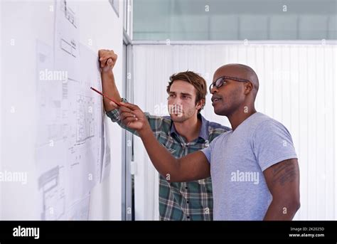 Are These Measurements Correct Two Male Architects Examining And