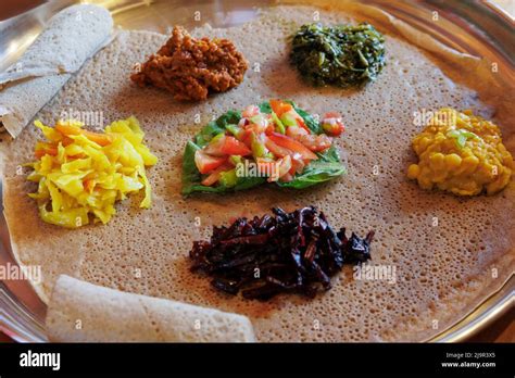 Injera Served With Vegetables And Lentils Injera The Staple Food Of