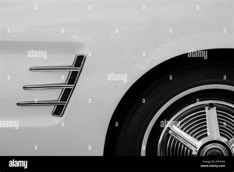 Detail Of A Vintage Classic Car Consisting Of Wheel And Air Flow Vent