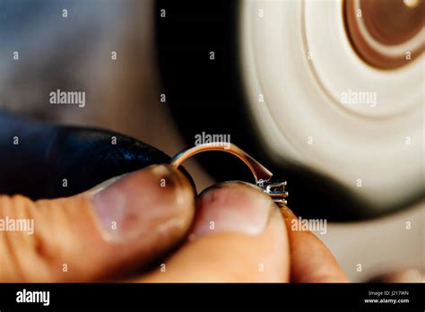 Jeweler Polishing Jewelry With Tools Stock Photo Alamy