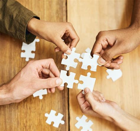 Putting The Pieces Together High Angle Shot Of A Group Of