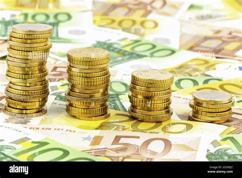 Stack Of Coins Falling Curve Symbolic Photo For Falling Interest Rates And Falling Costs Stock