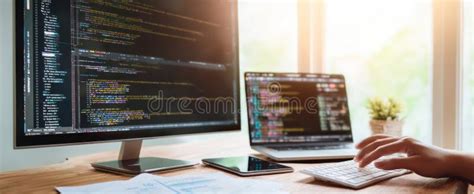 The Desk Setup Showcasing Coding On A Dual Screen Workspace With