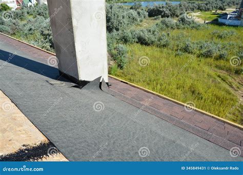 House Roofing Construction With Laying Asphalt Shingles For