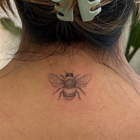 Little Bee Tattoo Located On The Upper Back
