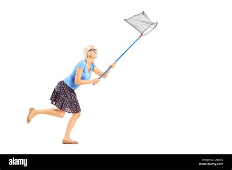Full Length Portrait Of A Woman Running With Butterfly Net Isolated On