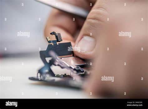 Cell Phone Repair At Service Center Smartphone Disassembling And Diagnostics Repairman