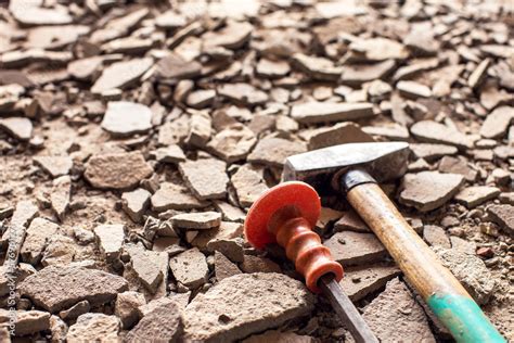 Hammer And Chisel On Broken Concrete Construction Waste Stock Photo Adobe Stock