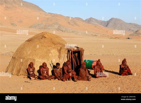 Himba Women At Hut Village Near Serra Cafema Wilderness Safaris At