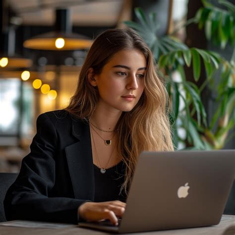 Premium Photo Woman Sitting In Front Of Laptop Computer