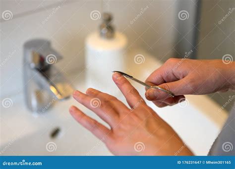 Woman Trimming Her Nails With Nail Scissors Stock Image Image Of