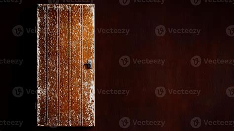 Vintage Wooden Door With Intricate Patterns Against A Dark Wall