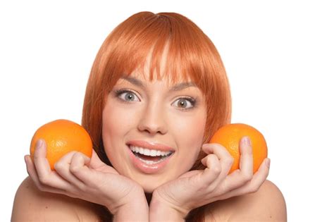Premium Photo Portrait Of Young Woman Posing With Oranges
