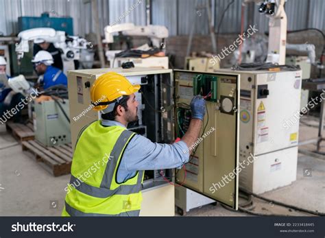 500 Robotics Engineer Working On Maintenance Modern Robotic Arm Factory Warehouse Images Stock