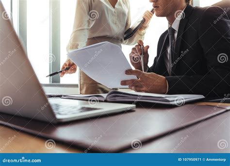 Colleagues Comparing Documents In Office Stock Image Image Of Overview Corporate 107950971